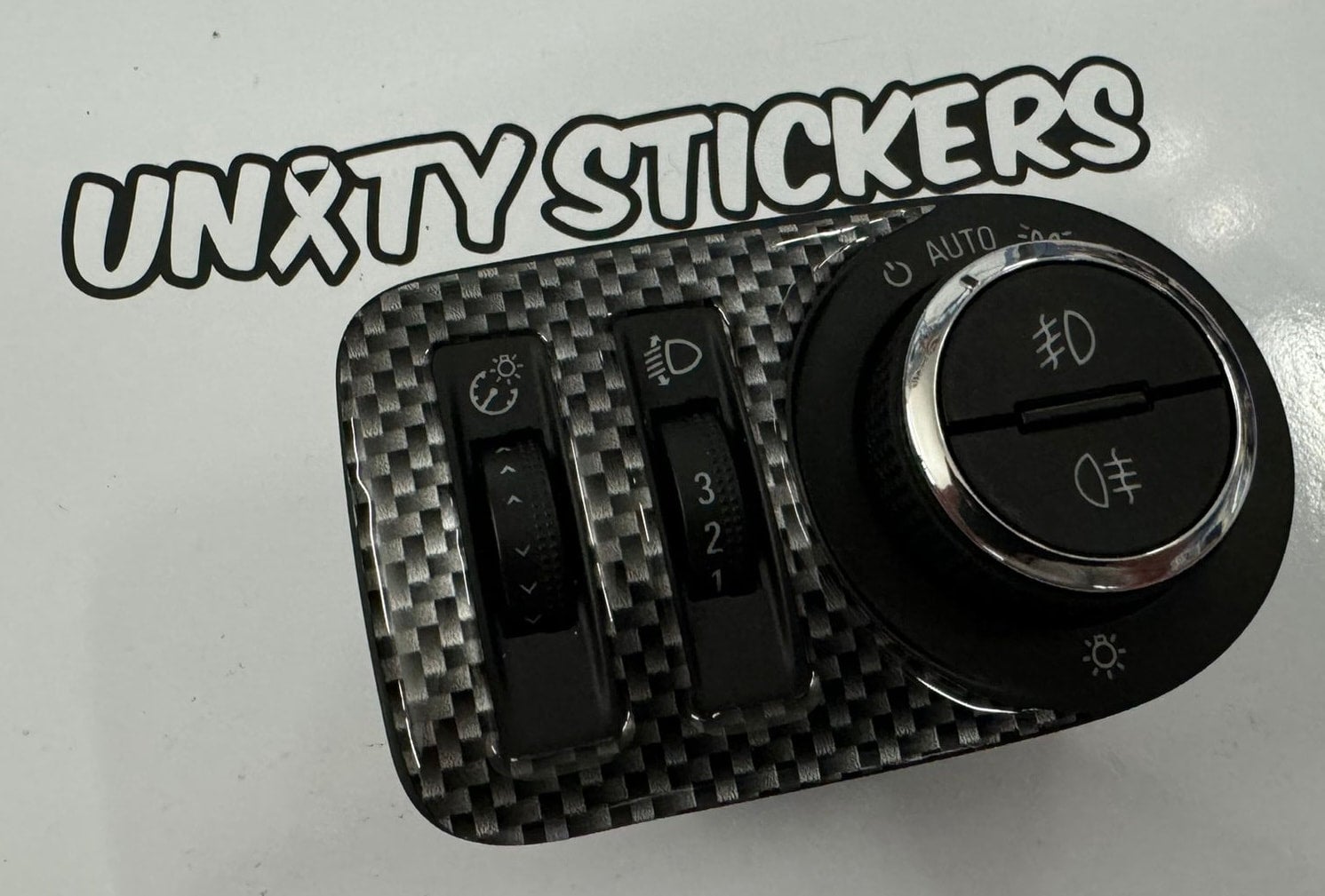 VAUXHALL CORSA E HEADLIGHT CONTROL SURROUND GEL | UnityStickers
